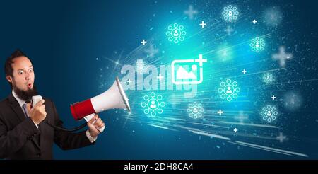 Young person with megaphone and social networking icon Stock Photo - Alamy