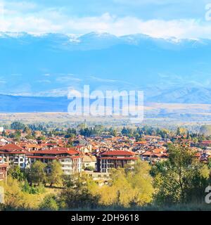 Bansko town autumn panorama with Pirin mountains and colorful fall ...