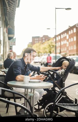 Entertainment in the stroller Stock Photo - Alamy
