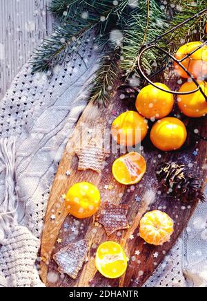 Board with sweet tangerines on color background, closeup Stock Photo ...