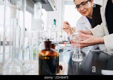 Midsection of caucasian young female teacher with african american ...
