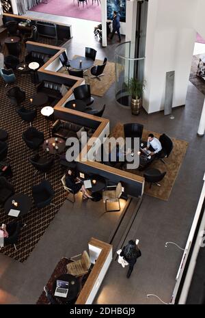 High angle view of business people discussing in office Stock Photo - Alamy
