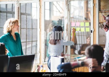 Indian businessman discussing work and plans with employees in ...
