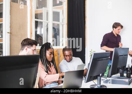 Team of programmers working in office Stock Photo - Alamy