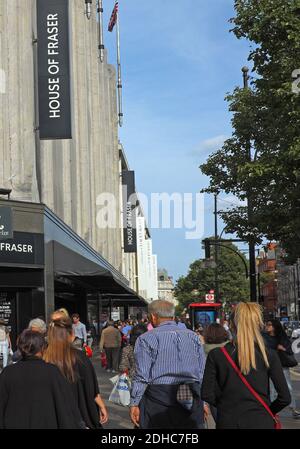 People walk past House of Fraser, with signs that say ‘Closing down. 50 ...