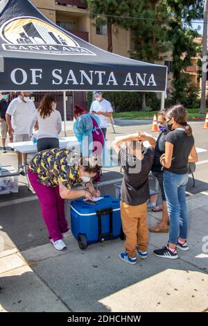 Girl in a medical mask with a Santa hat. High quality photo Stock Photo ...