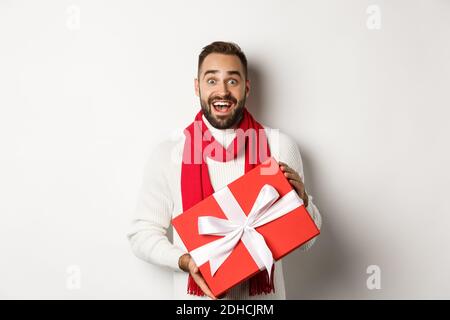 People, holidays and christmas concept - surprised man in deer's horns ...