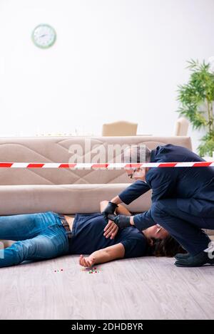 Old male forensic expert at the crime scene Stock Photo - Alamy