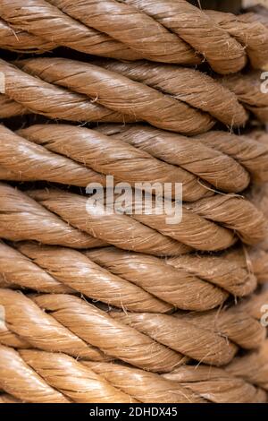 A rope wrapped around a pole. The texture of the rope Stock Photo - Alamy