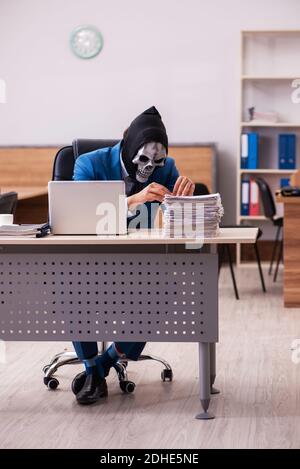 Devil businessman employee working in the office Stock Photo - Alamy