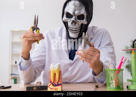 Devil doctor working in the clinic Stock Photo - Alamy