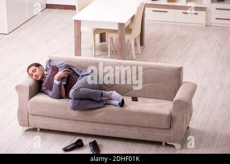 Tired business man coming home late at night Stock Photo - Alamy