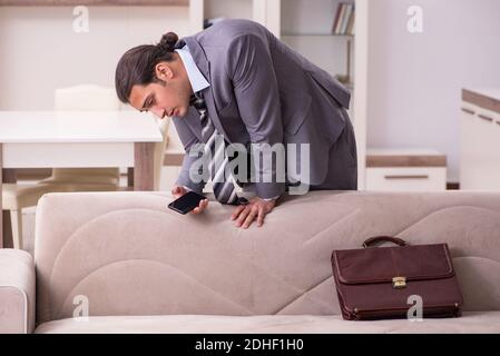 Tired business man coming home late at night Stock Photo - Alamy