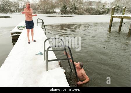 Winter swimmers, braves the snow and ice for their daily swim in ...