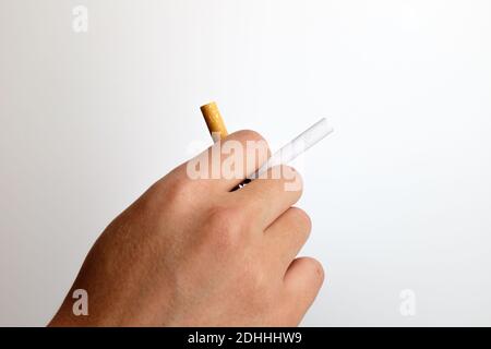 Short cigarette on white background Stock Photo - Alamy