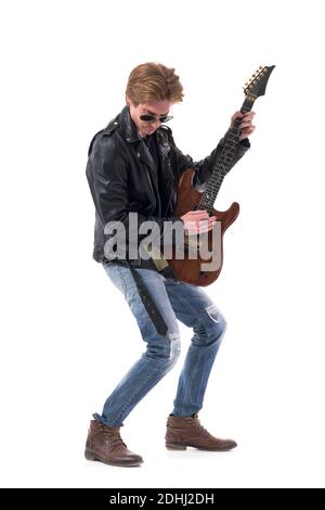 Side view of talented passionate rock and roll guitarist playing ...