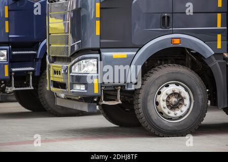 Close up two lorry cabs & trailer with driver from Maritime logistics ...