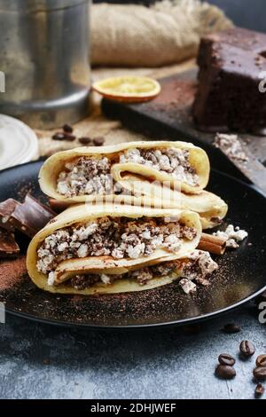 Crepes filled with chocolate and cottage cheese. Party dish Stock Photo ...