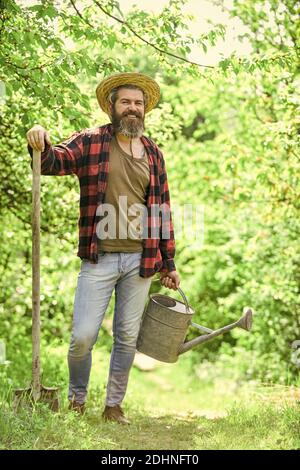 watering plants and the lawn in a big green garden watering plants in a ...
