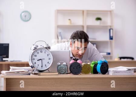 Young employee afraid of missing deadline at workplace Stock Photo - Alamy