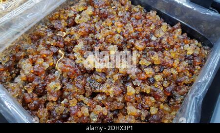 Natural resin secreted from the peach tree, forming amber-like crystals ...