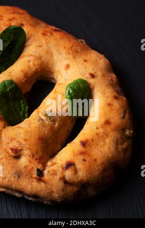 Food concept traditoin French Fougasse artisan flatbread on black slate ...