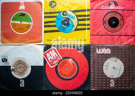 Selection of seven inch singles on vinyl with original paper sleeves ...