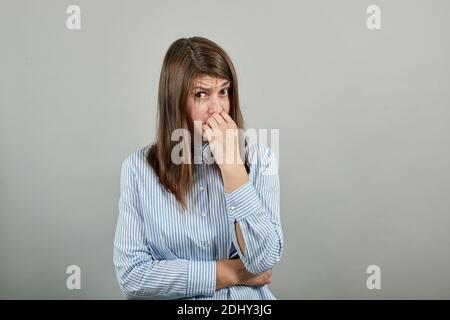 Man biting his knuckle Stock Photo - Alamy