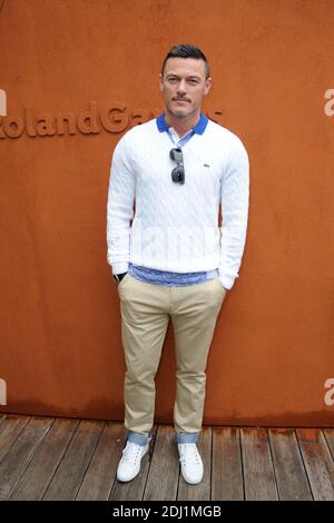 Luke Evans posing at the Village during French Tennis Open at Roland ...