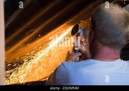 Flex cutting metal with sparks Stock Photo - Alamy