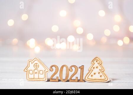 Wooden numeral and a small house nearby on a white background ...