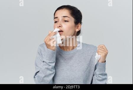 Woman holding napkin near face health problems runny nose flu Stock ...