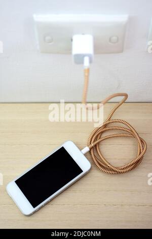 Mobile phone being charged up Stock Photo - Alamy