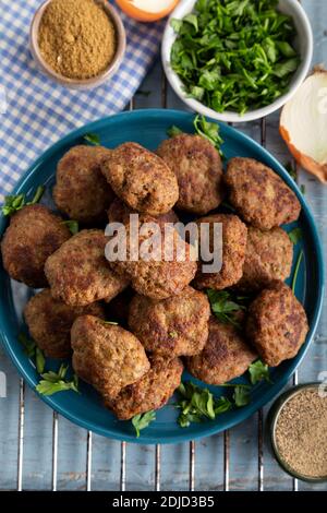 Turkish style barbecue meatballs, meatballs, onion, tomato, green ...