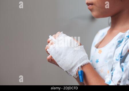 intravenous injection to the child. Hand of a child with a needle ...