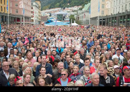 Cycling fans watch the podium ceremony after the the tenth stage of the ...
