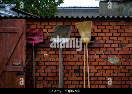 farmers tools on the barn wall Stock Photo - Alamy