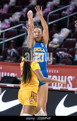 UCLA Bruins guard Natalie Chou (23) and forward Emily Bessoir (13) trap ...