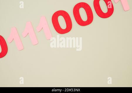 A top view of red and pink binary codes on a white surface Stock Photo ...