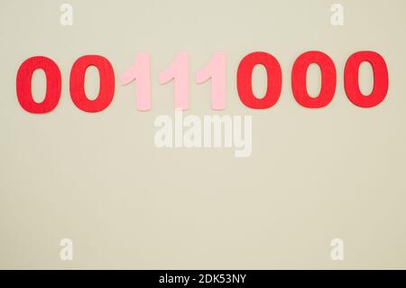 A top view of red and pink binary codes on a white surface Stock Photo ...