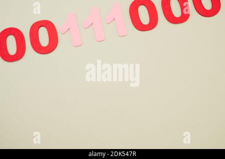A top view of red and pink binary codes on a white surface Stock Photo ...