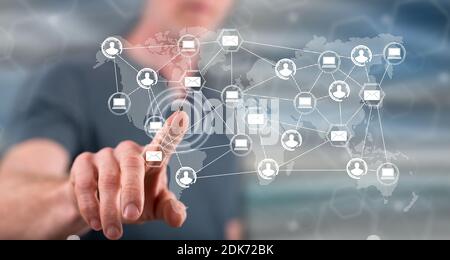 Man touching a social network concept on a touch screen with his finger ...