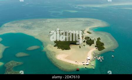 Luli island and sandy beach with tourists, sand bar surrounded by coral ...