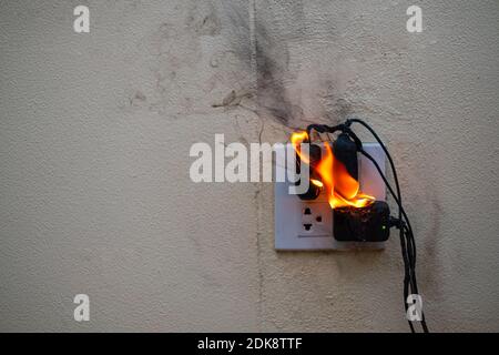 On fire adapter at plug Receptacle on white background, Electric short ...