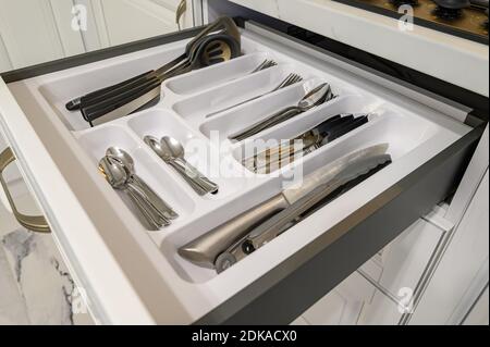 White counter with open drawer in kitchen, closeup Stock Photo - Alamy
