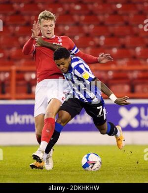Nottingham Forest's Joe Worrall (left) speaks with referee Peter Bankes ...