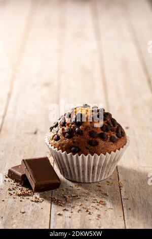 Chocolate muffins dessert with light plastic plate with holes isolated ...