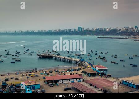 Peru. Lima city. Chorrillos port. Green coast Stock Photo - Alamy
