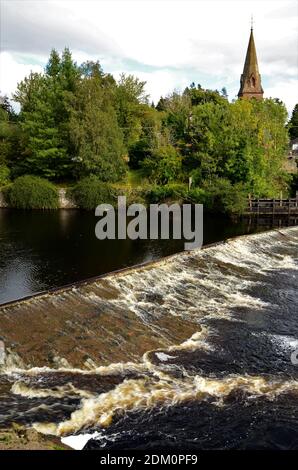 A view across a man-made weir on the river Ericht in the Perthshire ...