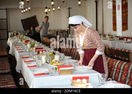 Waitress in national dress, Turkish restaurant, Istanbul, Republic of ...